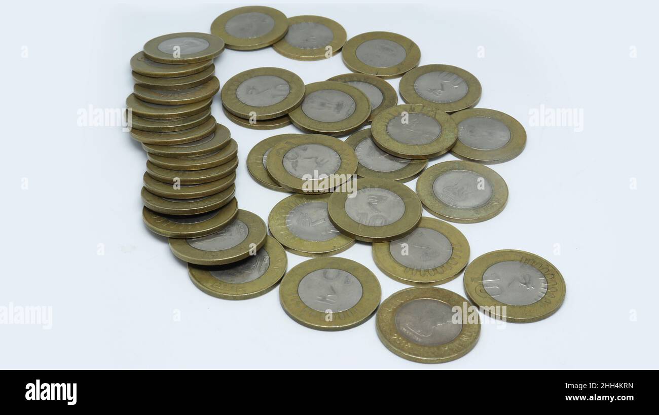 Pile of Indian Rupees Coins. Ten rupees coins. On a white background ...