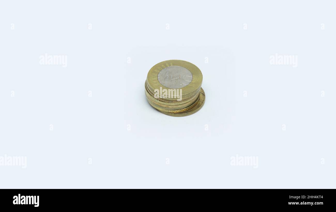 Pile of Indian Rupees Coins. Ten rupees coins. On a white background ...