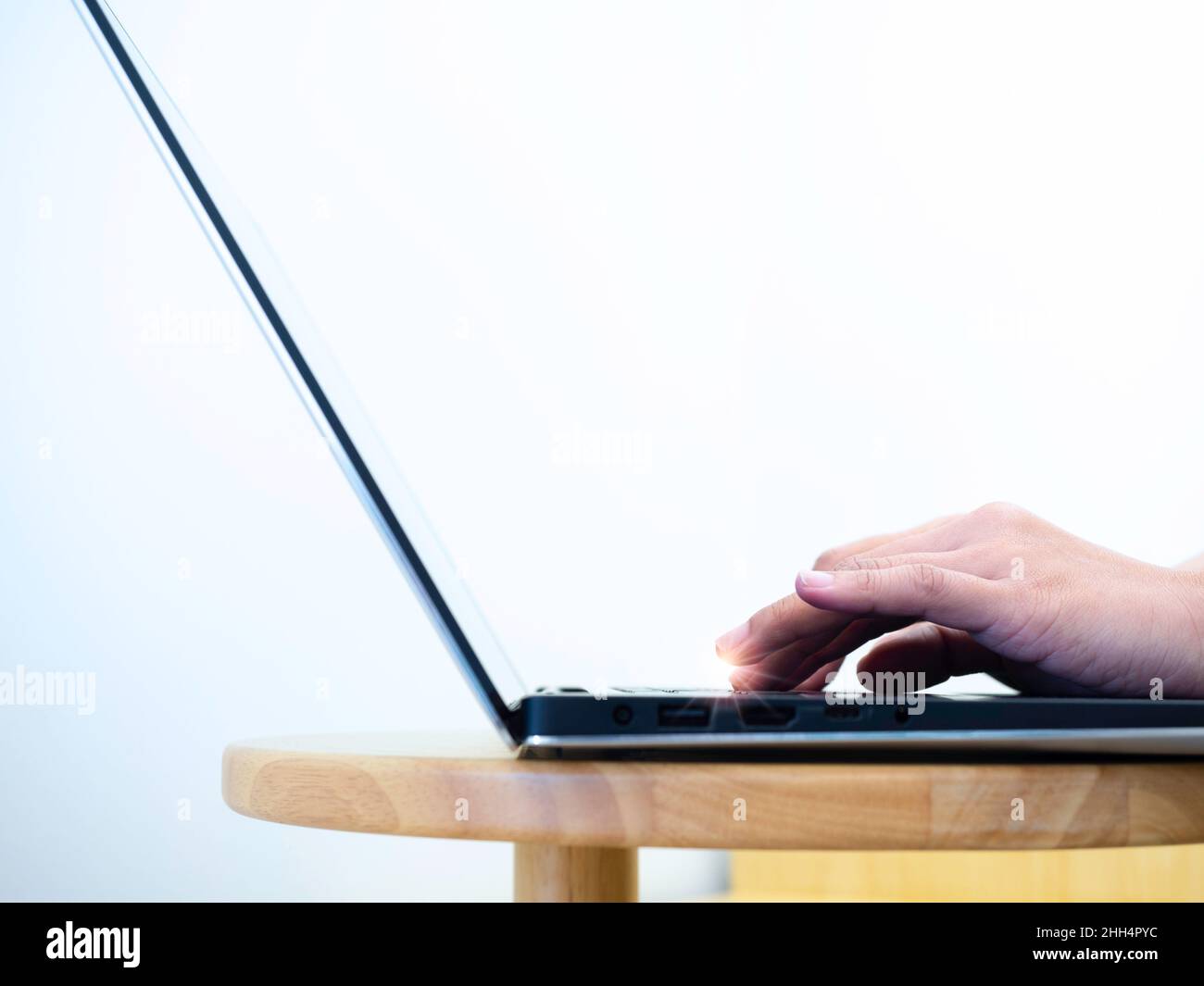 Close up of woman hands typing on laptop computer keyboard on round ...