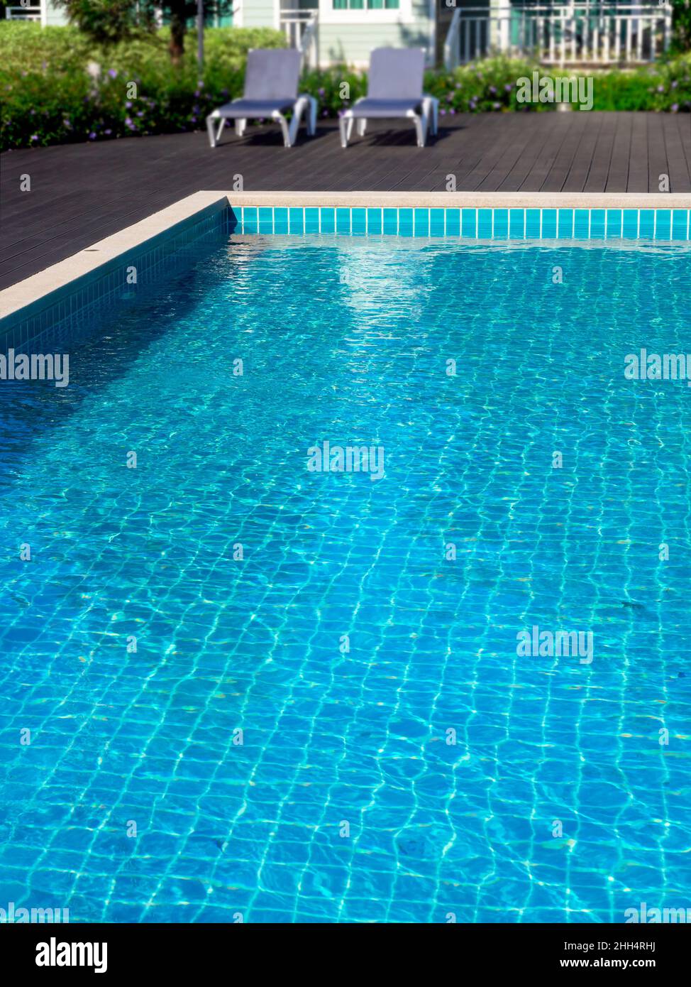 Swimming pool with clean clear water, vertical style, nobody. Square ...