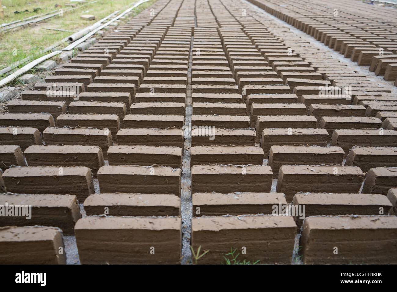 Making bricks from clay. After the clay is molded into bricks, after ...
