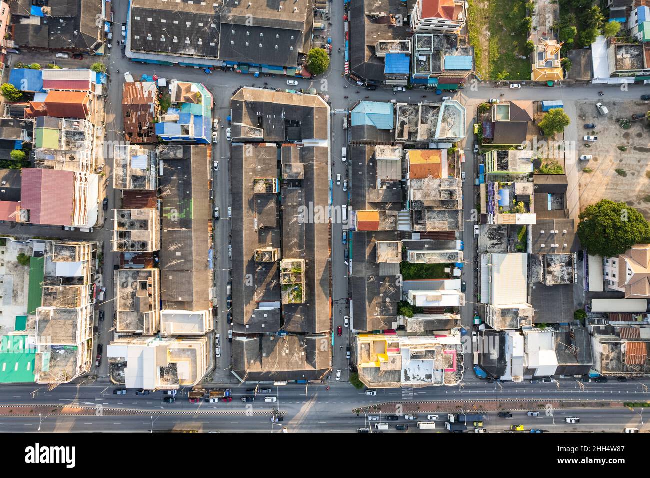 Top view of commercial building and car on the alley in suburban ...