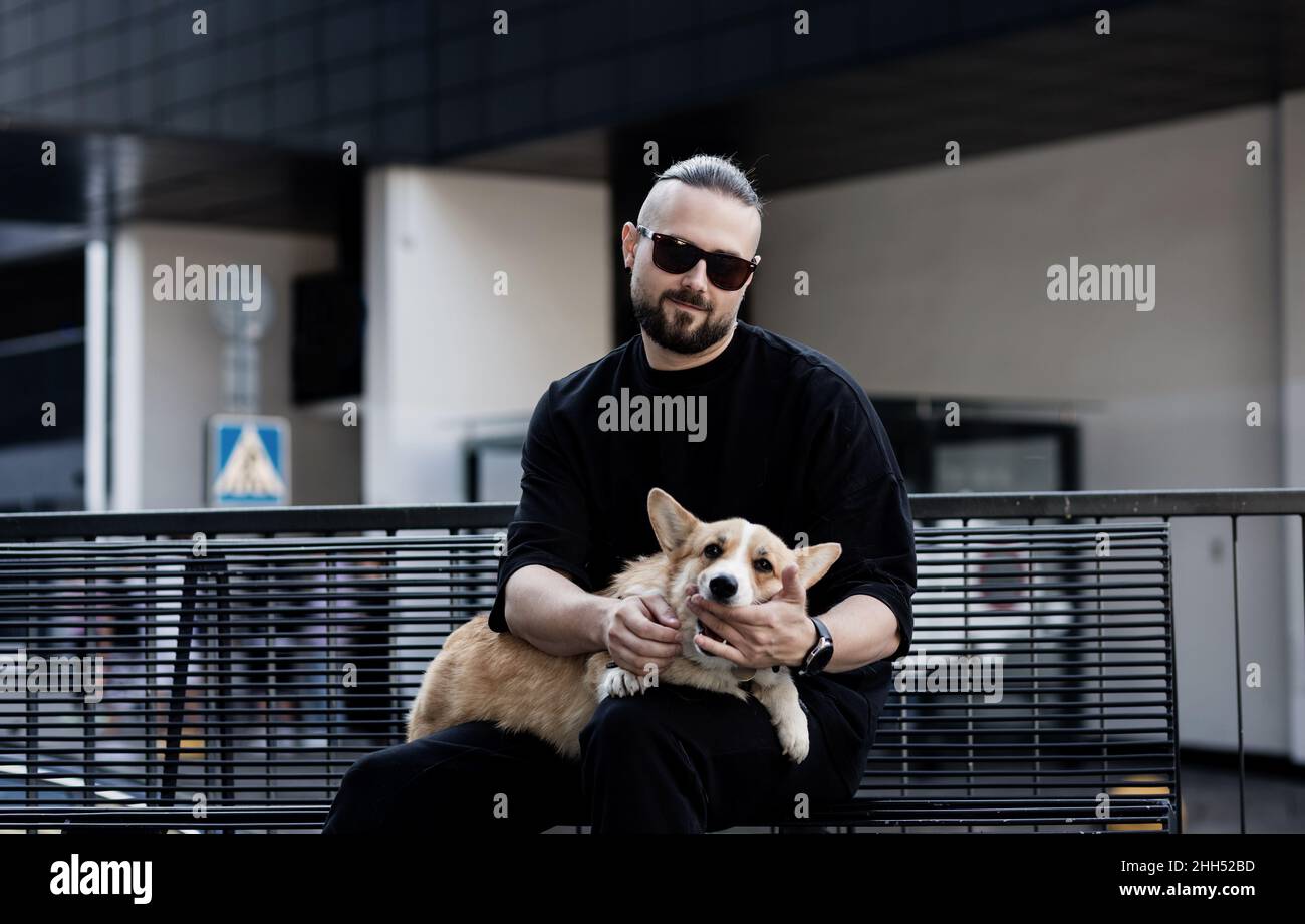 Man holds dog in arms hi-res stock photography and images - Alamy