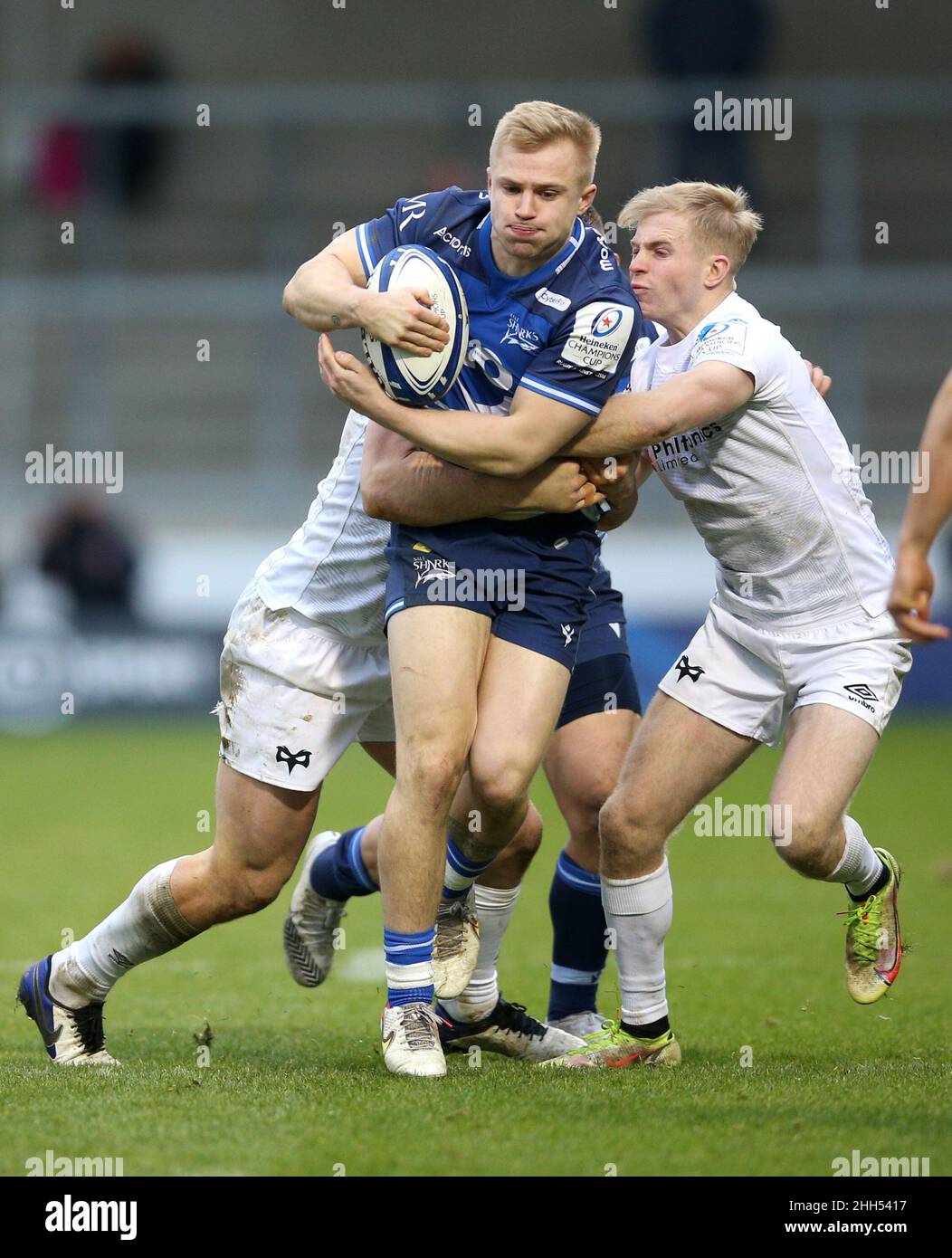 Sale Sharks' Aaron Reed (centre) tackled by Ospreys' Mat Protheroe ...