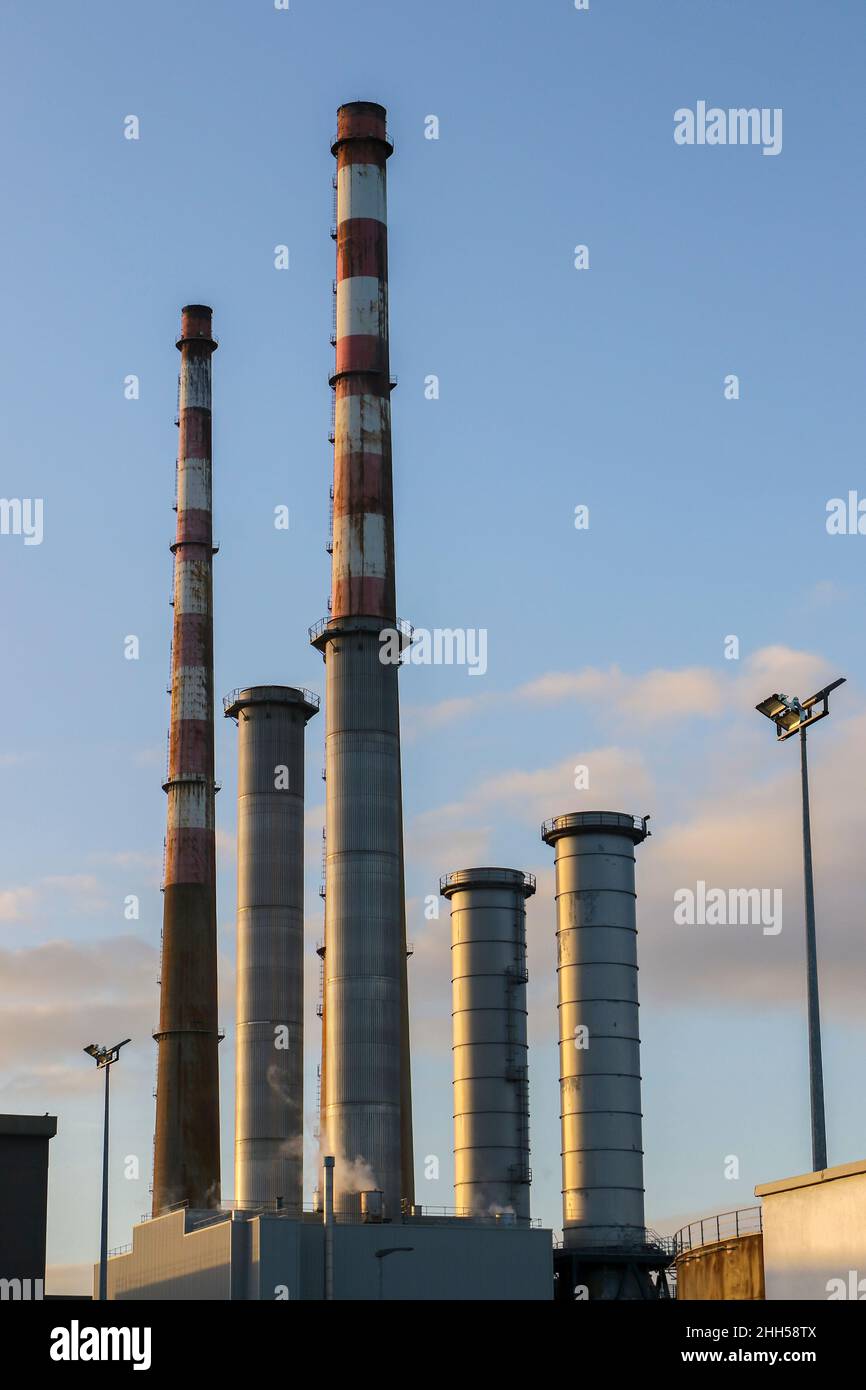 Chimneys of Poolbeg electricity generating station. Landmark red white ...