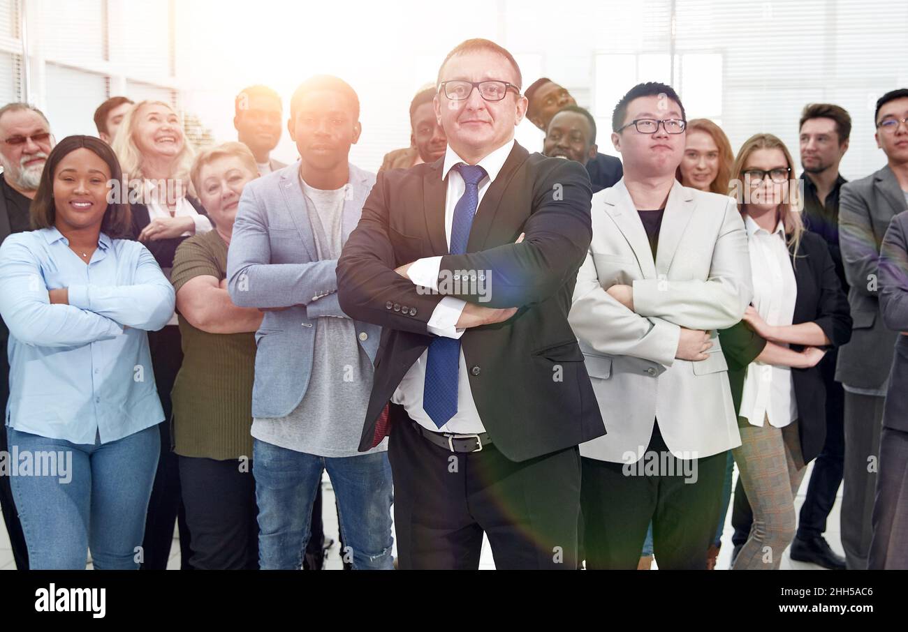 Group portrait of a creative business team, standing indoors, three ...