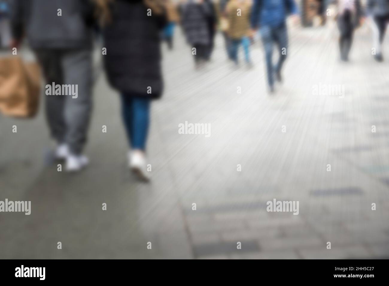 Blurry street with walking people. Bursting rays light Stock Photo - Alamy