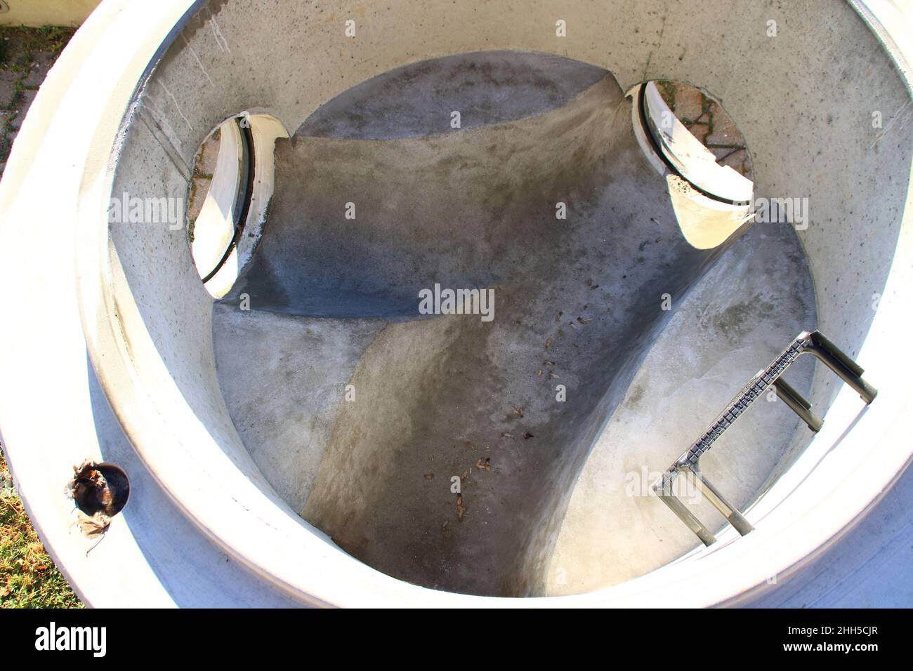 View from above into a sewer manhole Stock Photo - Alamy