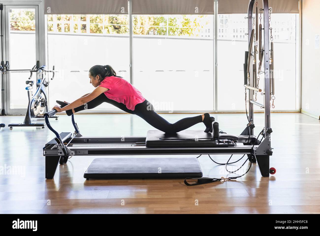 Young athletes doing the leg splits on gym equipment Stock Photo - Alamy