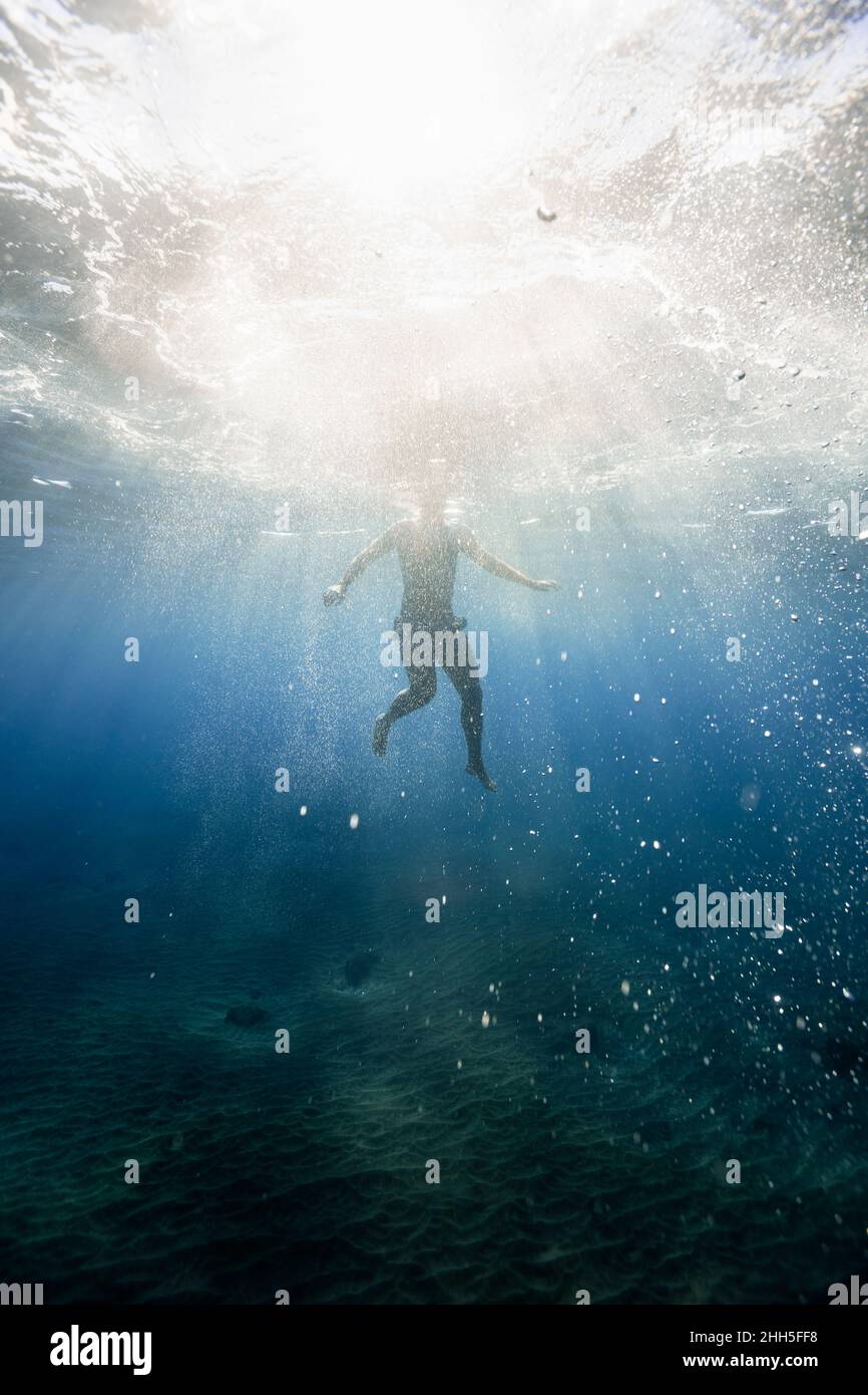 Person Falling Underwater