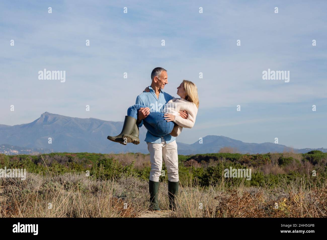 Romantic man carrying woman in hi-res stock photography and images - Alamy