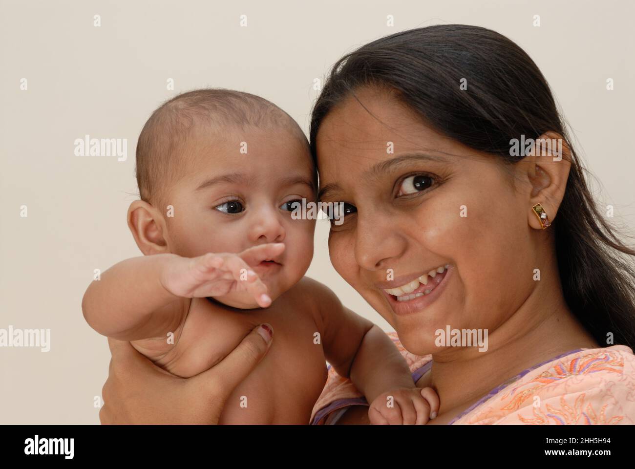 Indian mother newborn baby cuddling hi-res stock photography and images ...