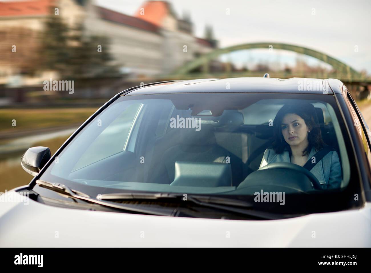 Woman driving electric vehicle on hi-res stock photography and images ...