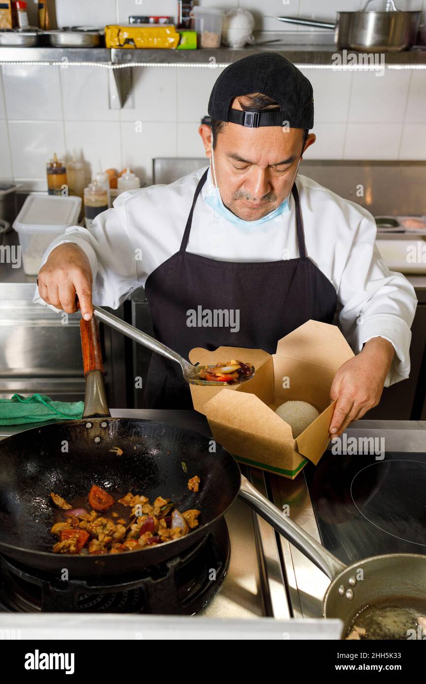 Chef preparing food parcel in restaurant kitchen Stock Photo - Alamy