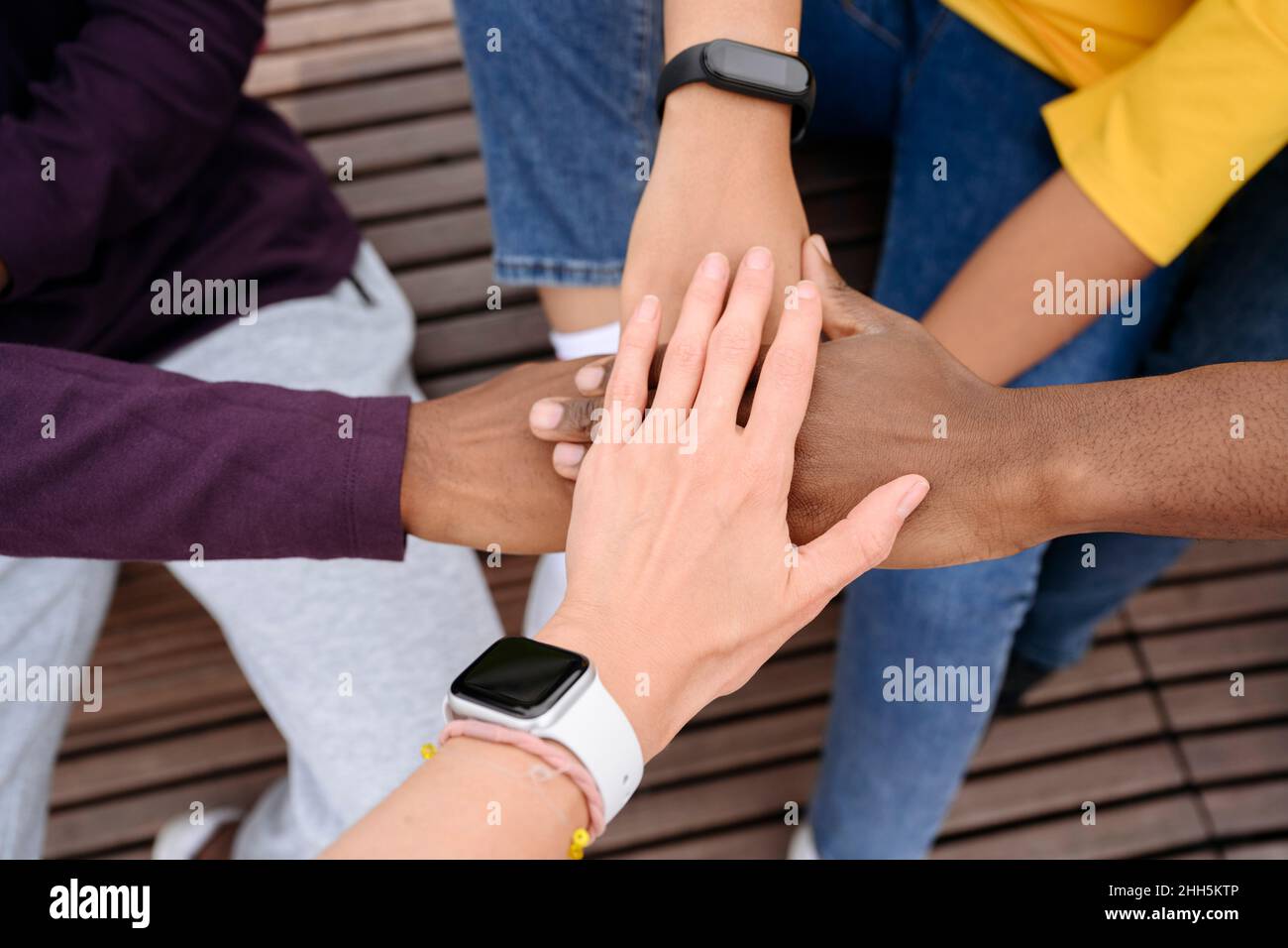 Multiracial friends doing hands stack Stock Photo - Alamy