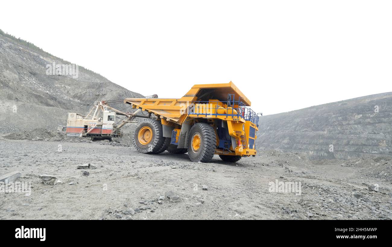 Heavy mining trucks moving on a limestone quarry. Heavy equipment Stock ...