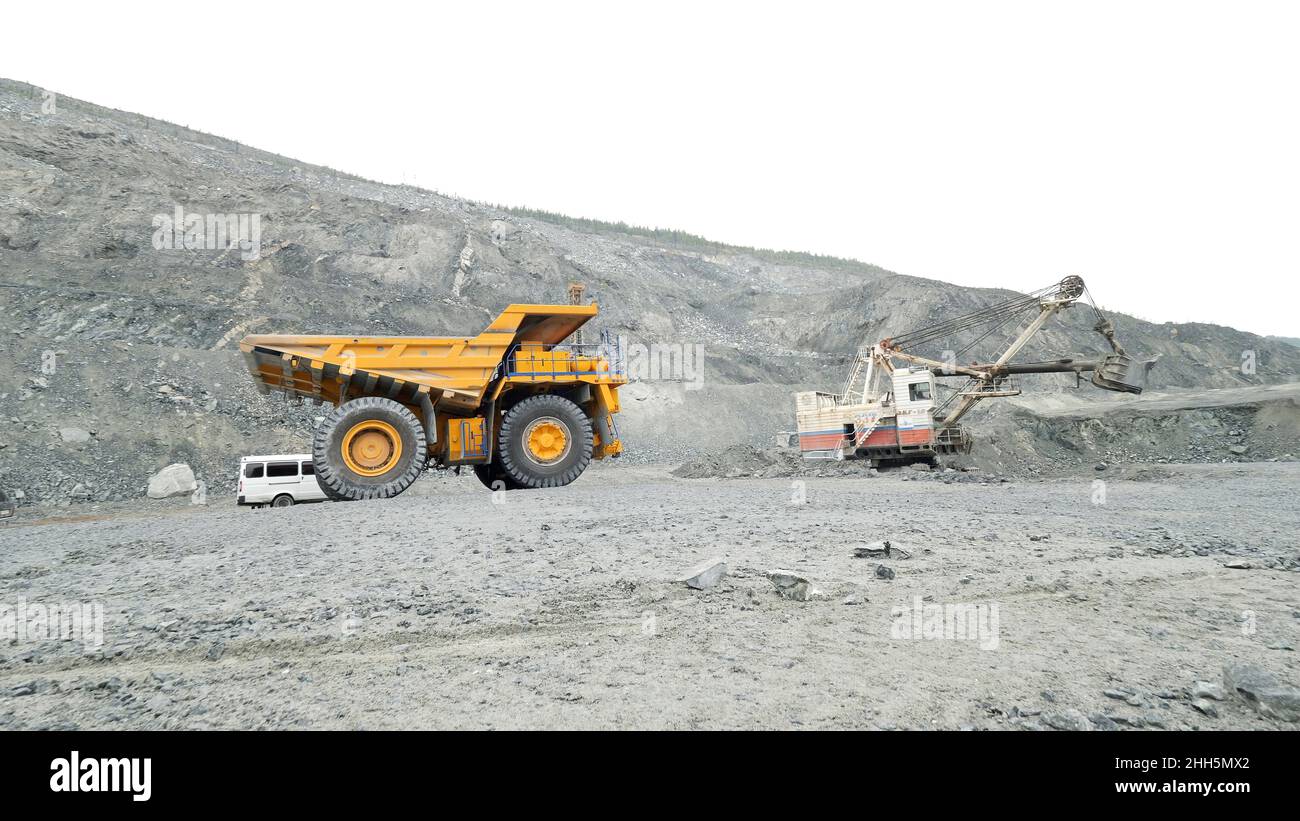 Heavy mining trucks moving on a limestone quarry. Heavy equipment Stock ...