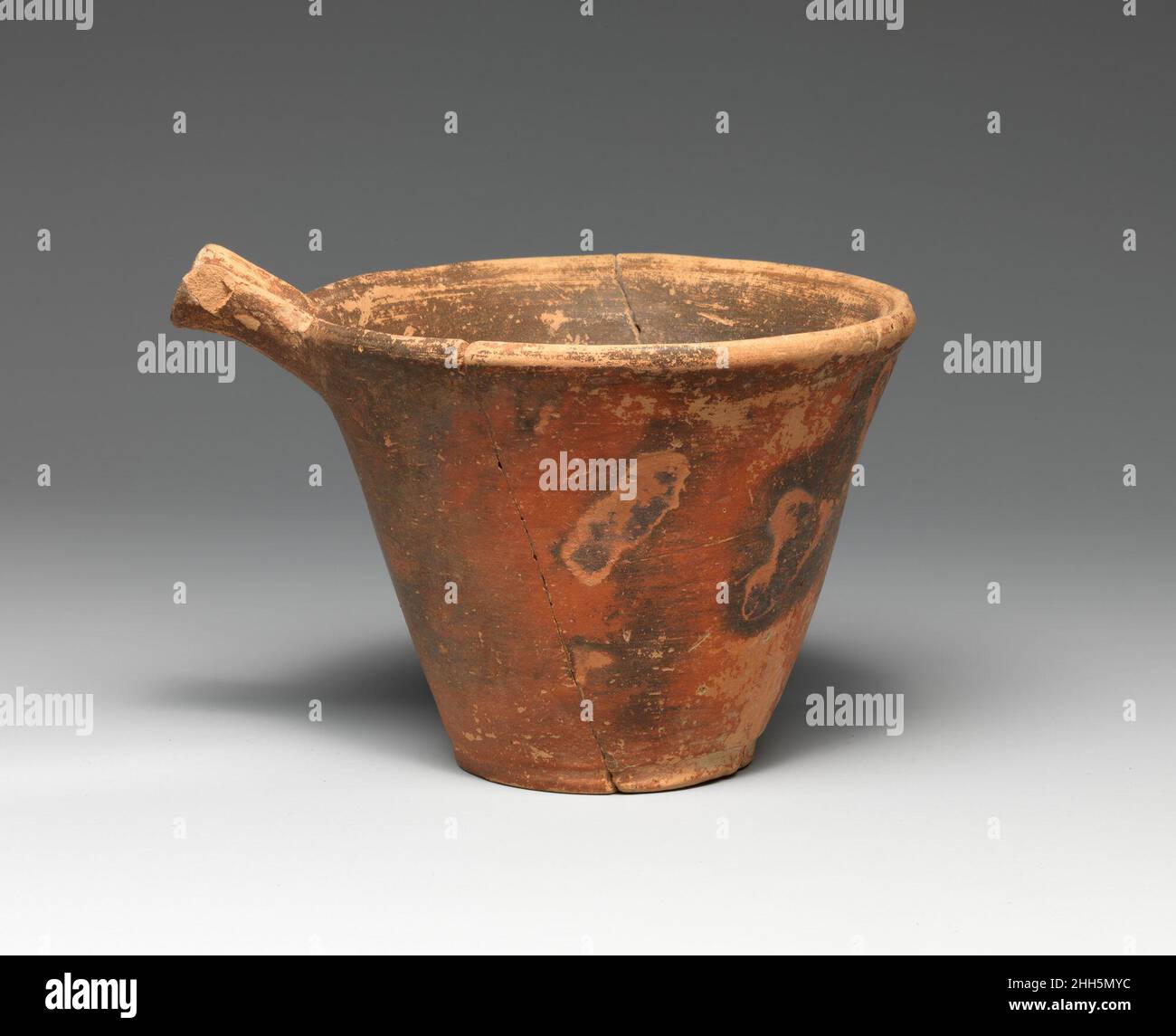 Terracotta spouted cup ca. 2600–2200 B.C. Minoan Mottled red and black ...