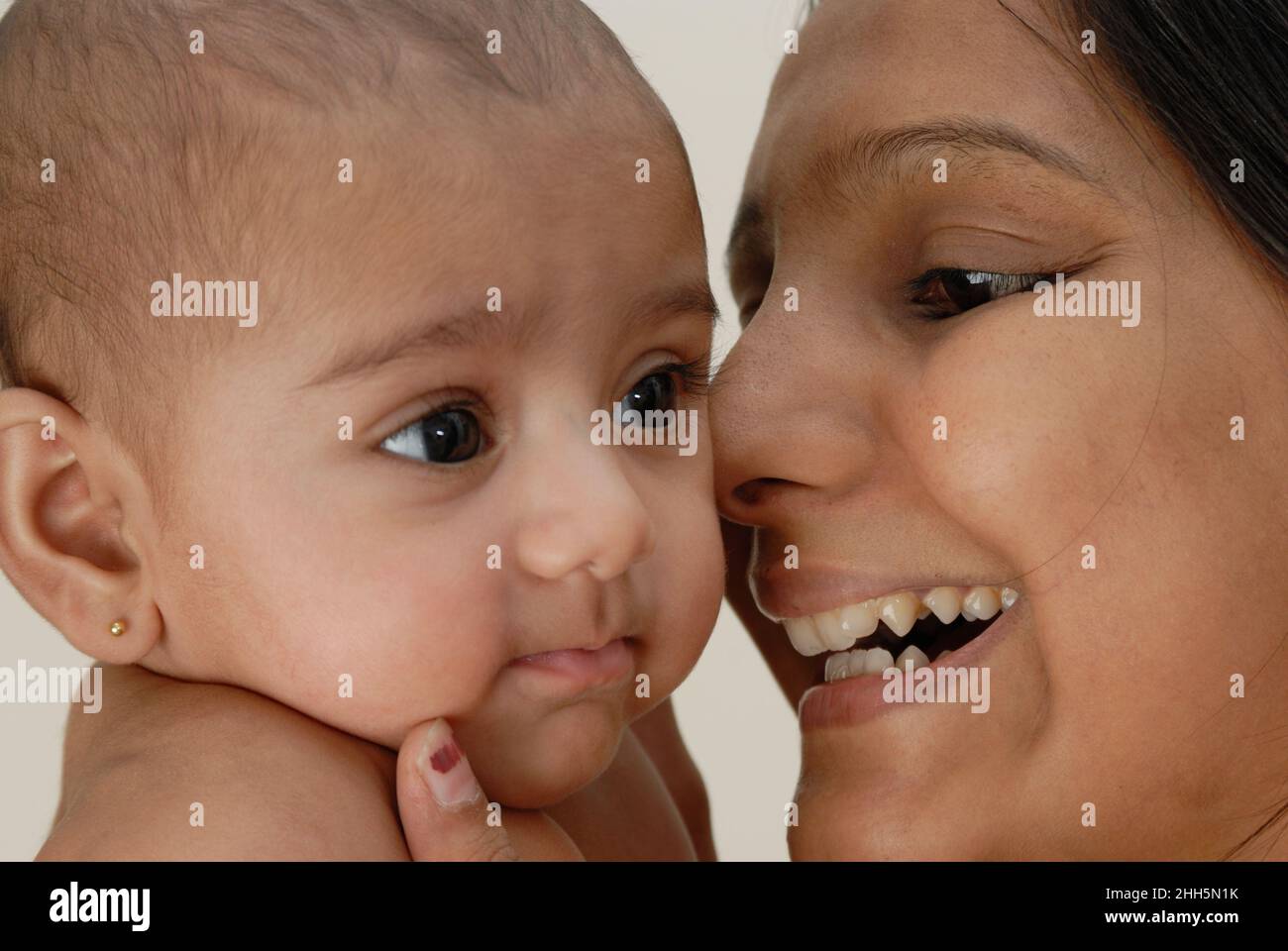 Indian mother newborn baby cuddling hi-res stock photography and images ...