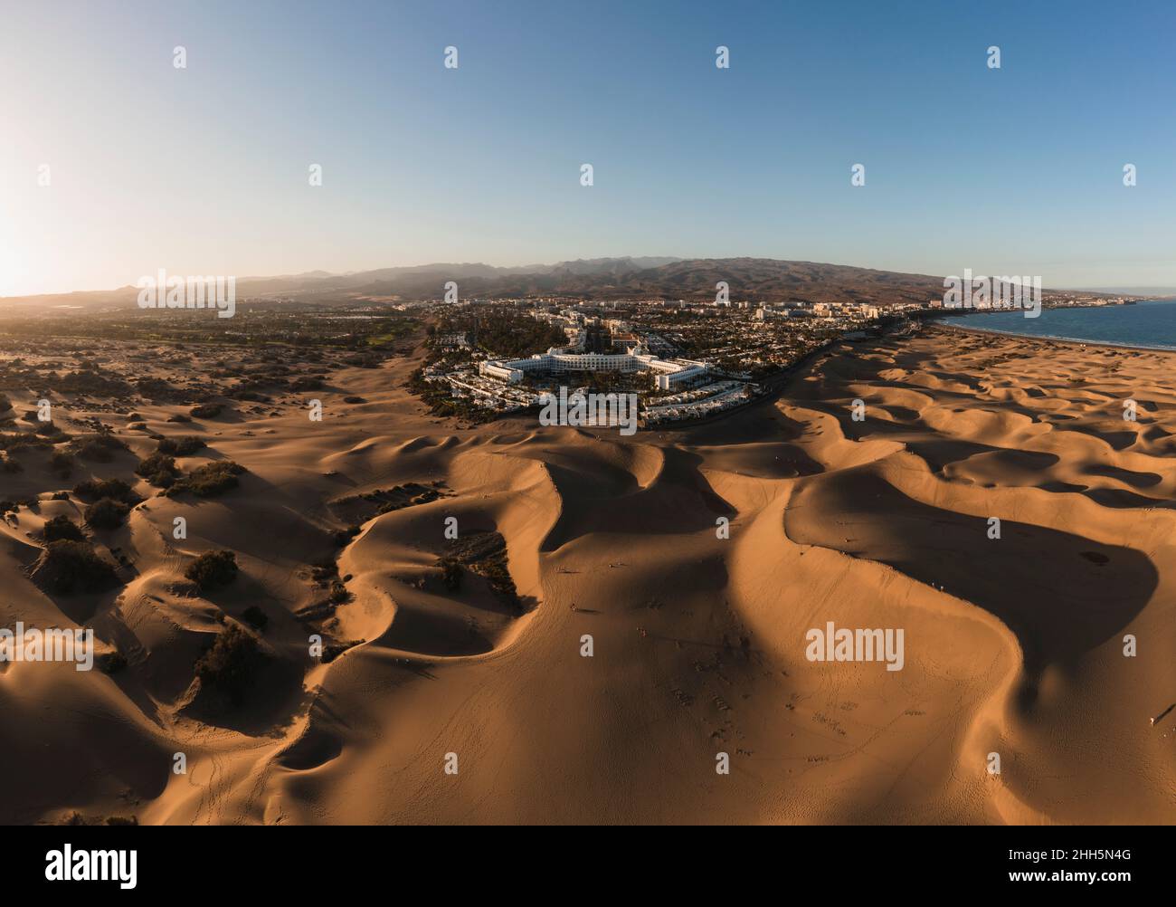 Maspalomas town amidst sand dunes sunset hi-res stock photography and ...