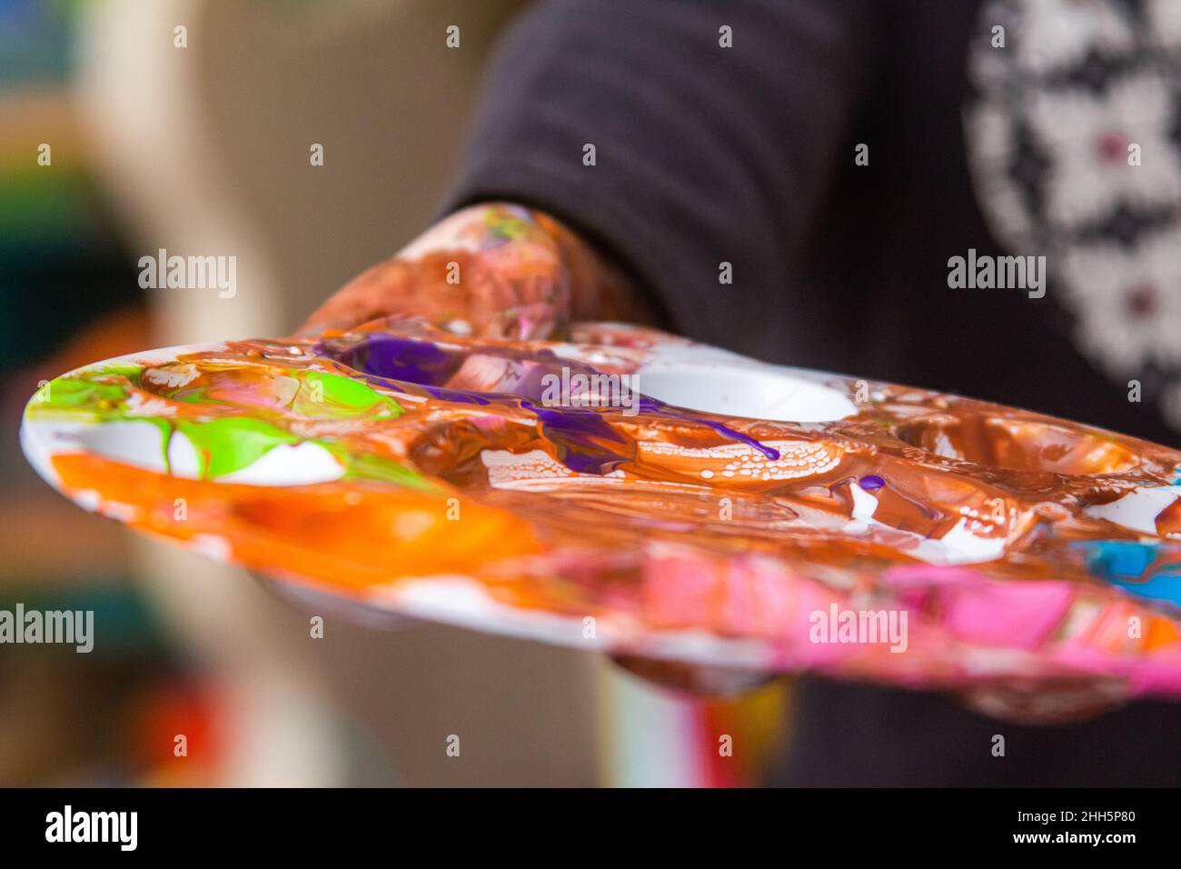finger painting with a paint tray colorful Stock Photo - Alamy