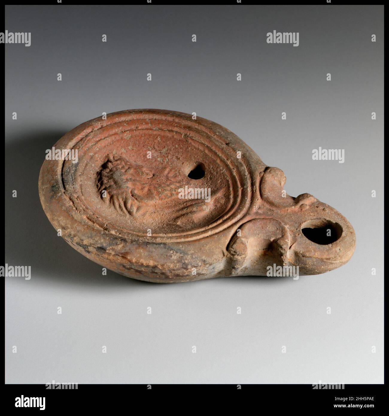 Terracotta oil lamp 2nd century A.D. Roman Discus: portrait head of a ...