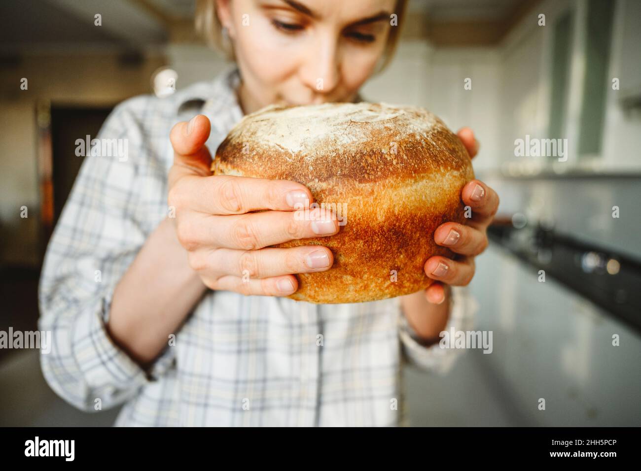 Adult smelling bread hi-res stock photography and images - Alamy