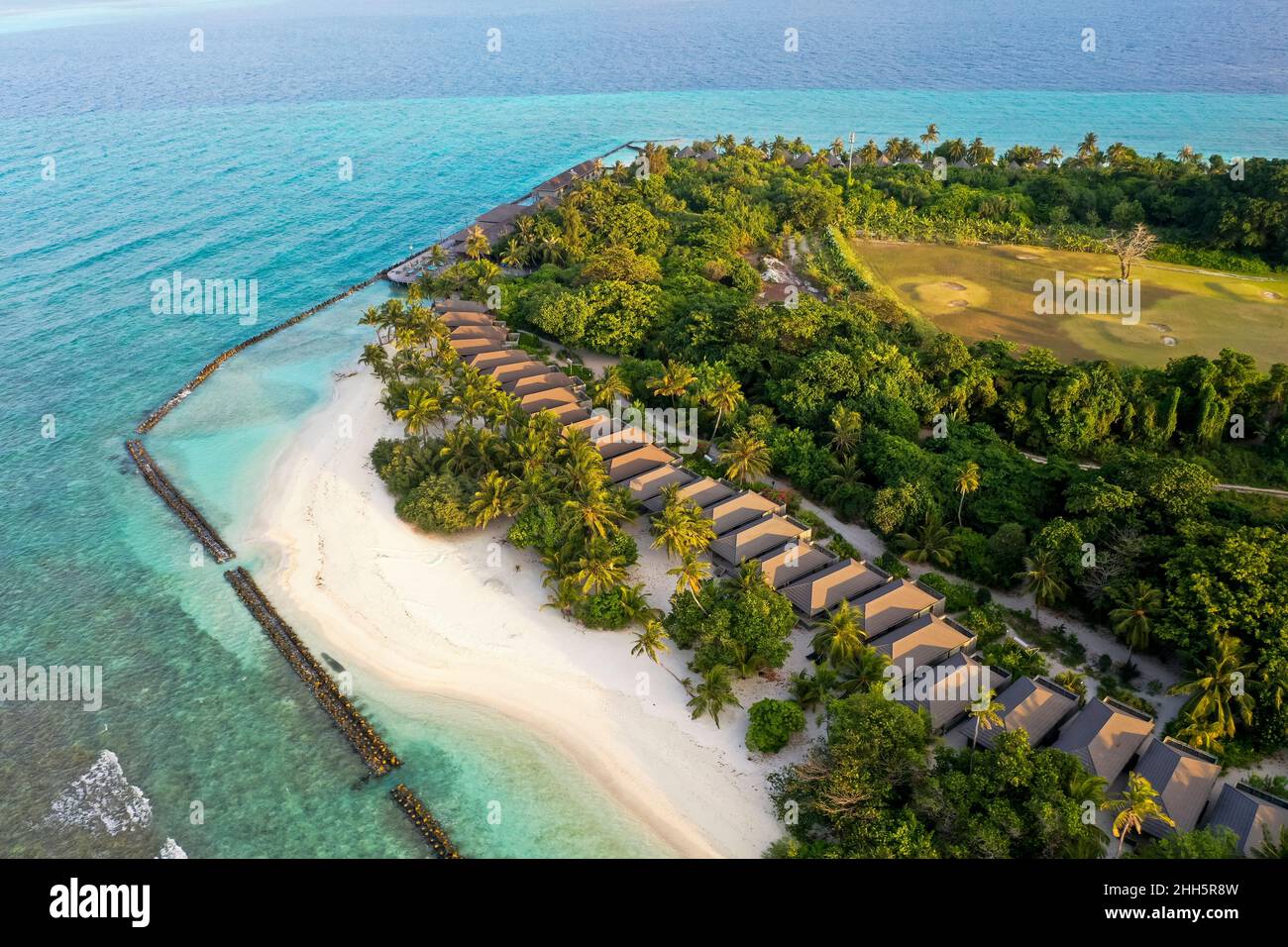 Lush trees with houses at Kuredu island in Lhaviyani Atoll, Maldives ...