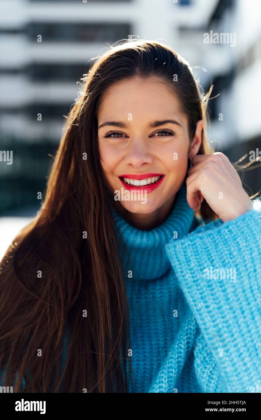 Happy woman wearing blue turtleneck hi-res stock photography and images ...
