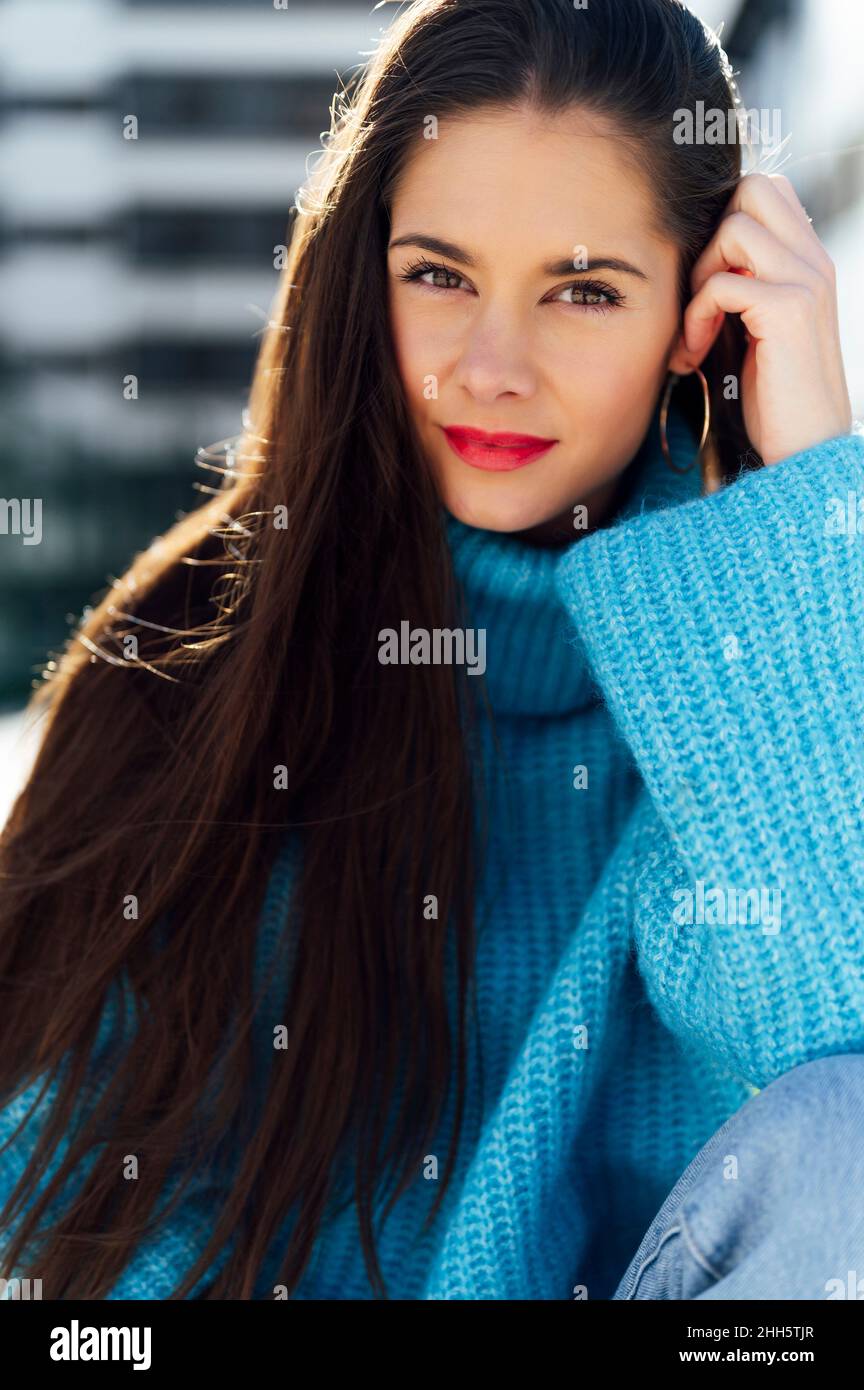 Beautiful woman with hand in hair Stock Photo - Alamy