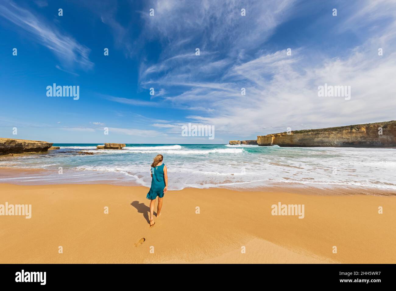 Female tourist walking alone along Sherbrook River Beach in Port ...