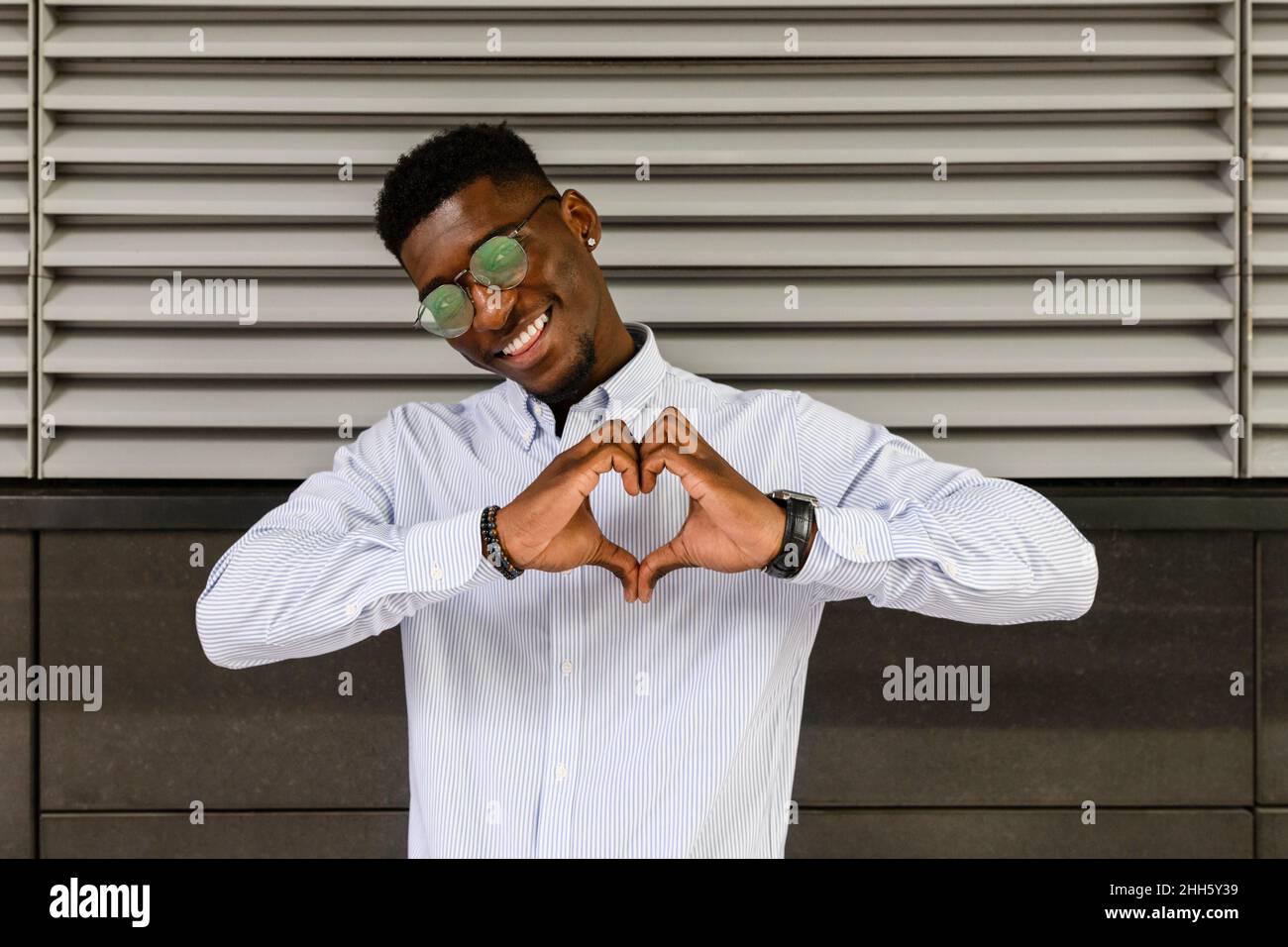 Man making heart hands hi-res stock photography and images - Alamy