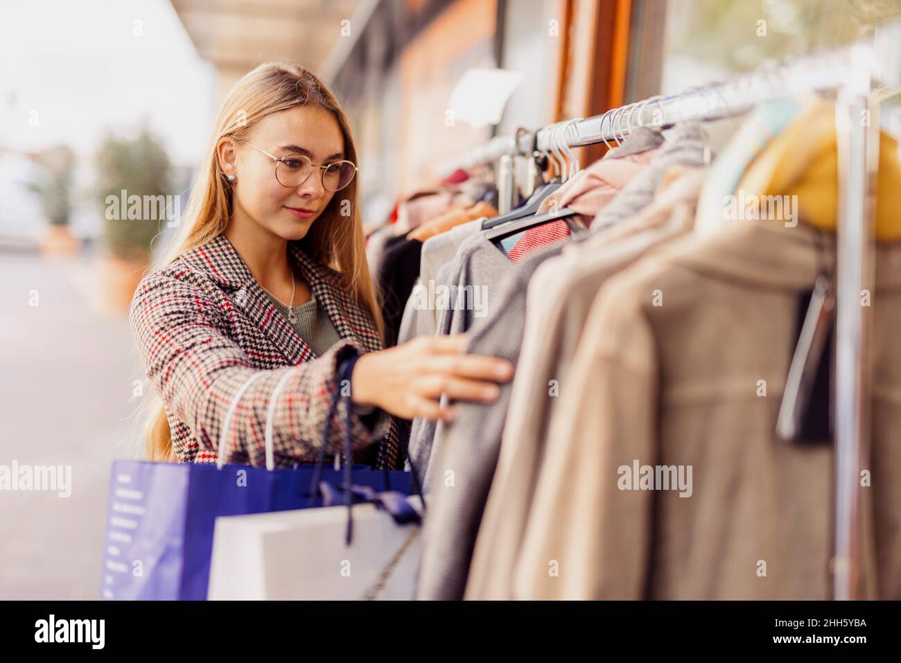 Female customer choosing glasses hi-res stock photography and images ...