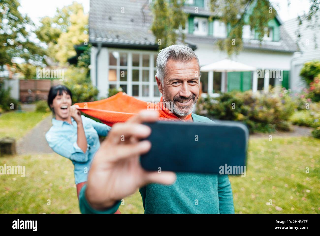 Happy mature woman pulling hi-res stock photography and images - Alamy