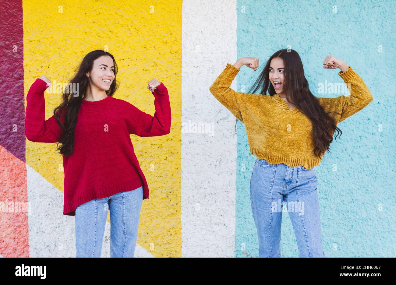 Family flexing muscles hi-res stock photography and images - Alamy