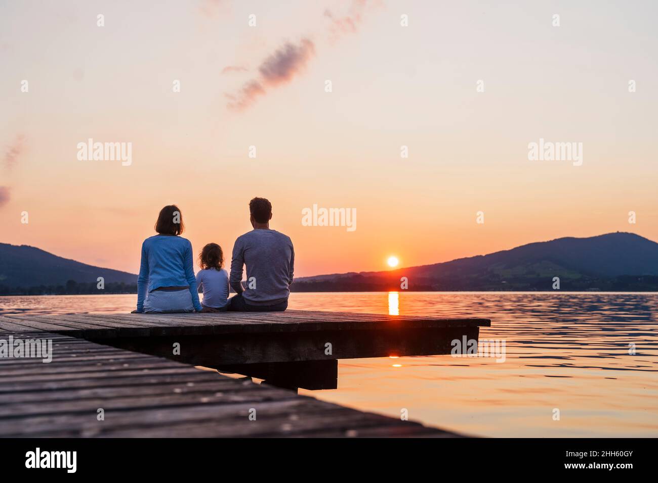 Family looking view jetty sunset hi-res stock photography and images ...