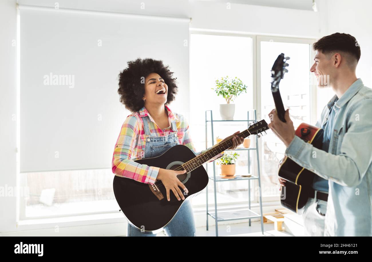 Cheerful multicultural couple making hi-res stock photography and ...