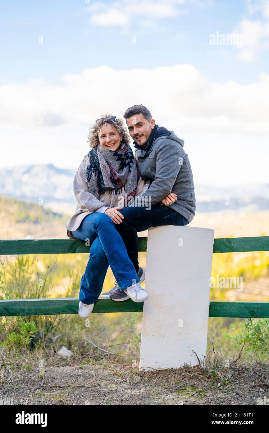 Portrait man sitting on railing hi-res stock photography and images - Alamy