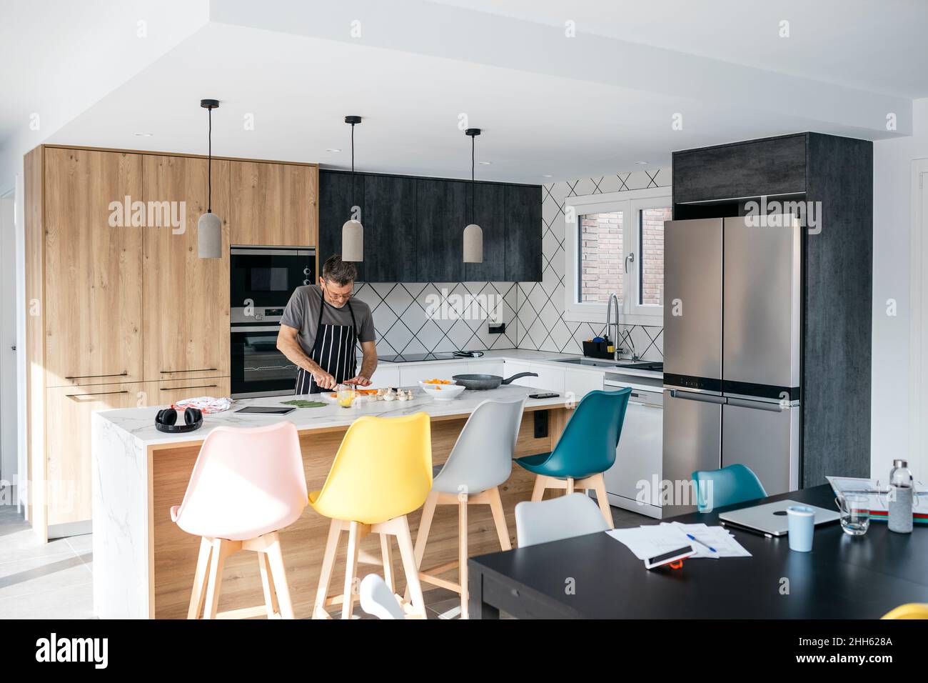 Man cooking food in kitchen at home Stock Photo - Alamy