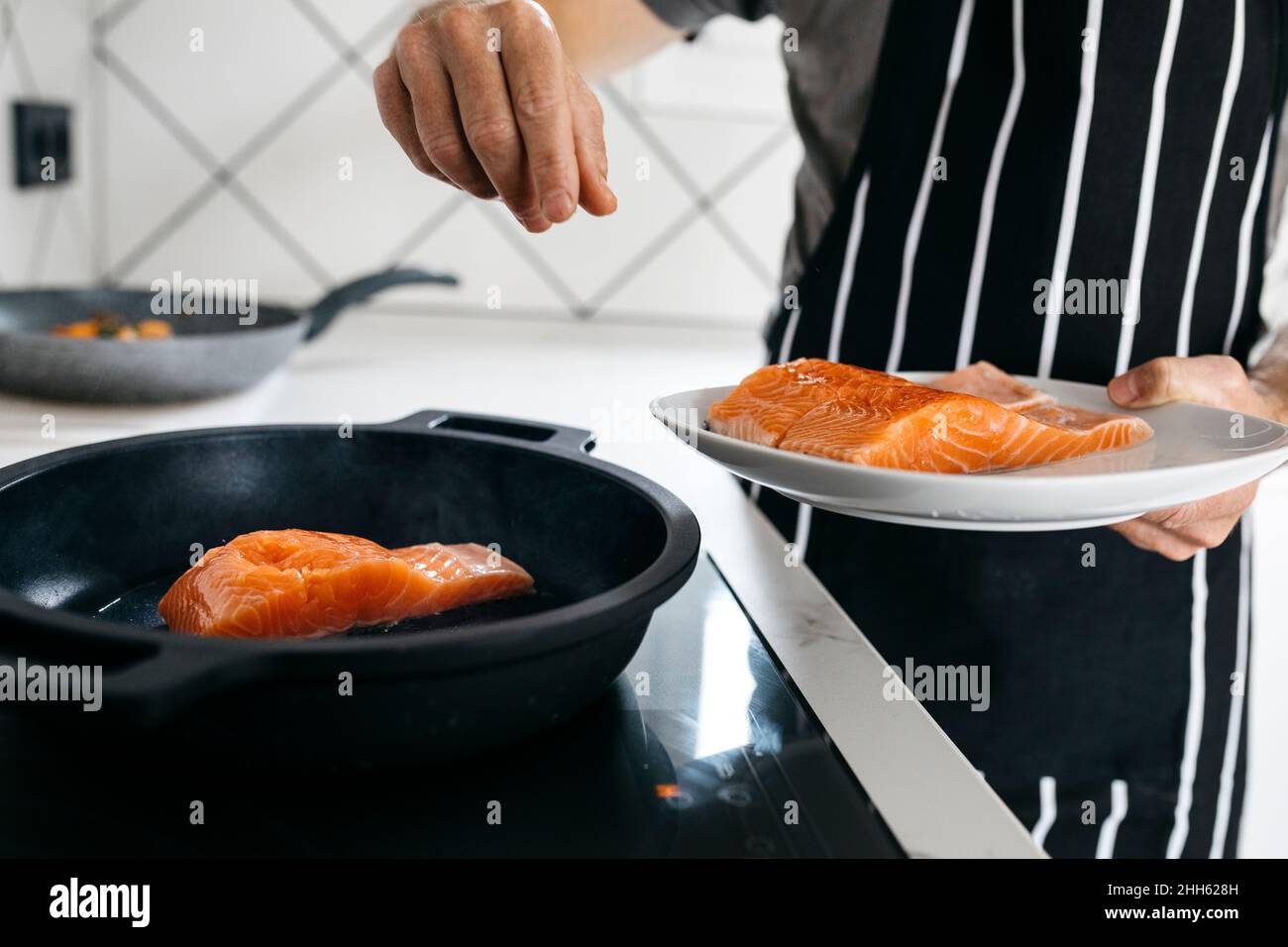 Male person cooking seafood hi-res stock photography and images - Alamy