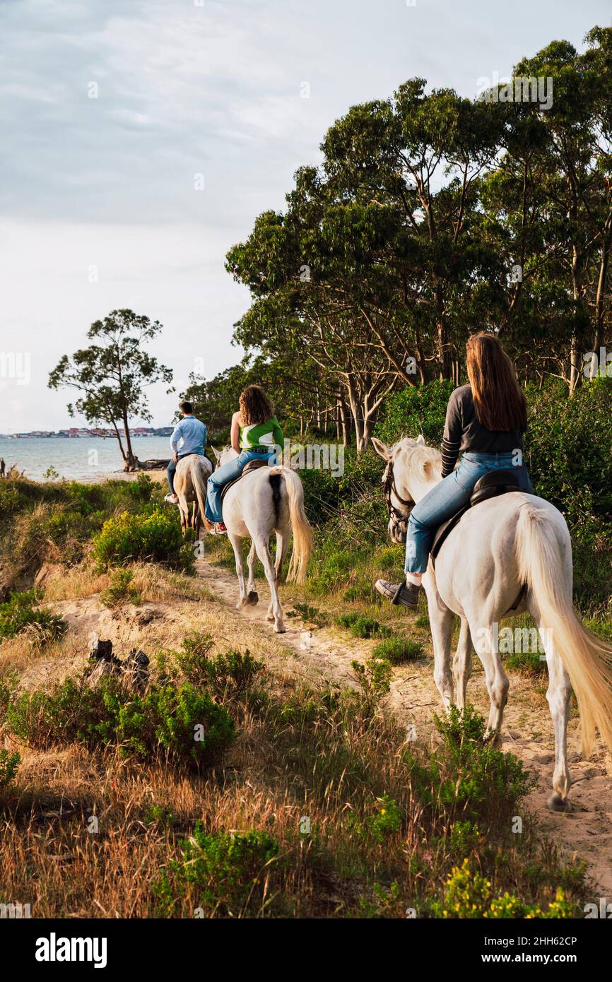 Riding horses at sunset hi-res stock photography and images - Alamy