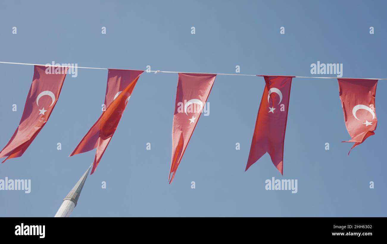 Turkish flags on rope. Action. Flags of Turkey are festively hung on ...
