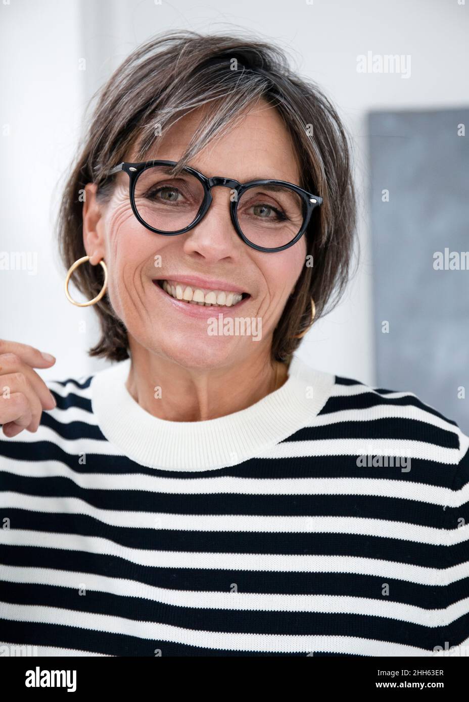 Happy mature businesswoman wearing eyeglasses Stock Photo - Alamy