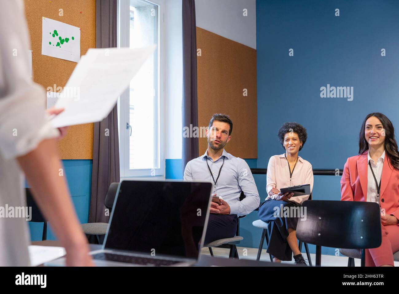 Smiling business colleagues attending meeting in office Stock Photo - Alamy