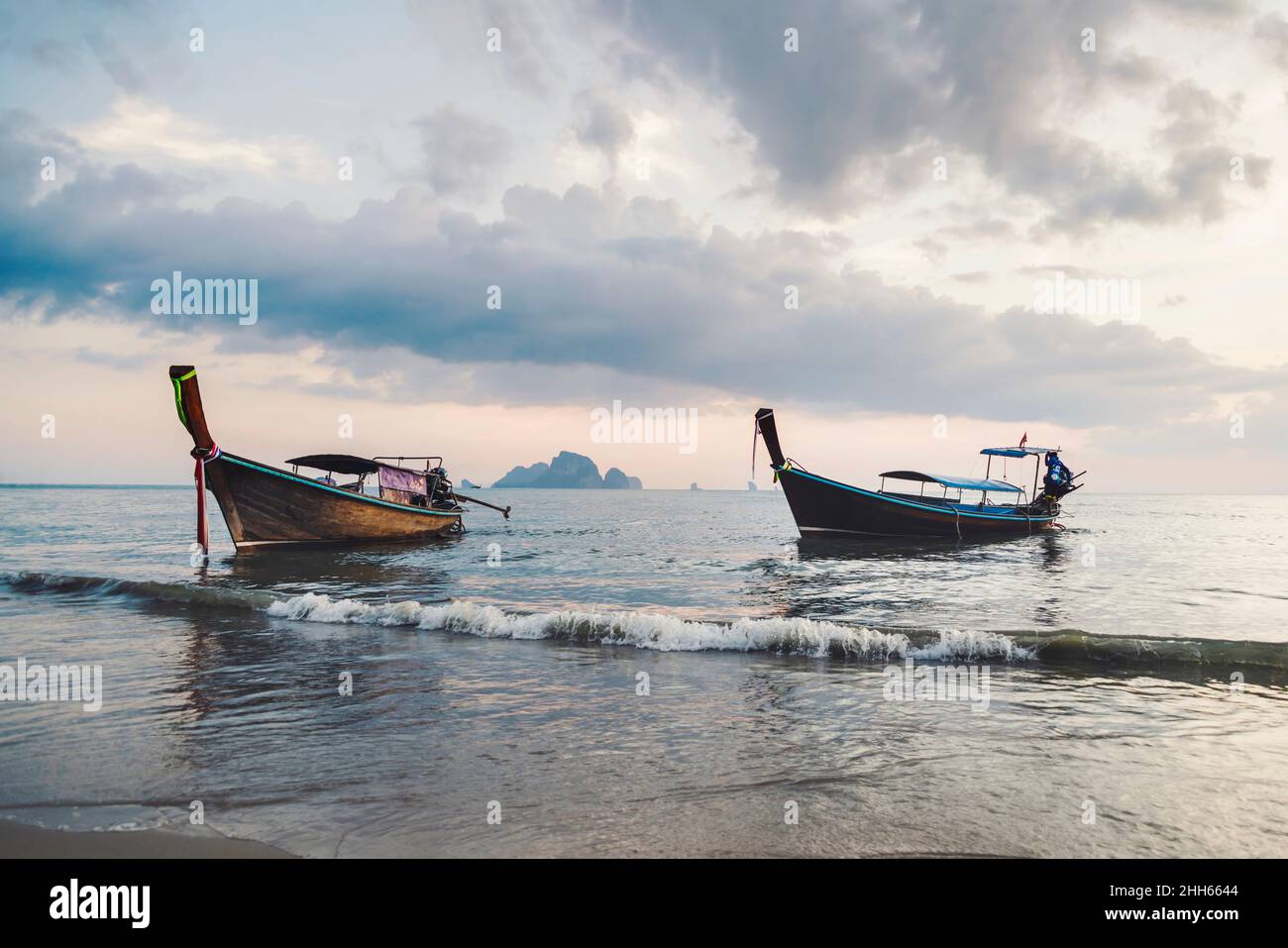 Longtail boats moored sea ao nang beach hi-res stock photography and ...