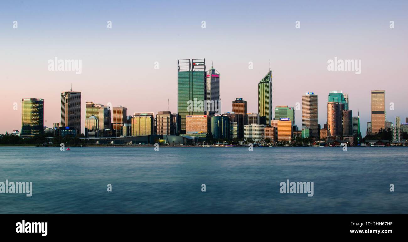 perth skyline over the swan river at sunset Stock Photo - Alamy