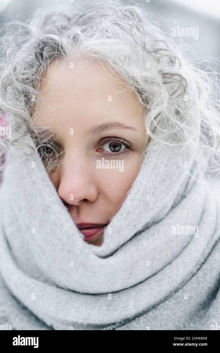 Woman with gray curly hair wrapped in scarf Stock Photo - Alamy