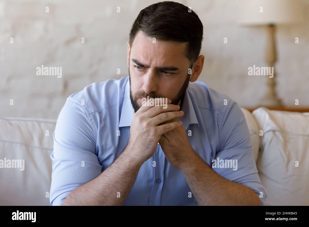 Worried concerned millennial business man thinking over bad news Stock ...