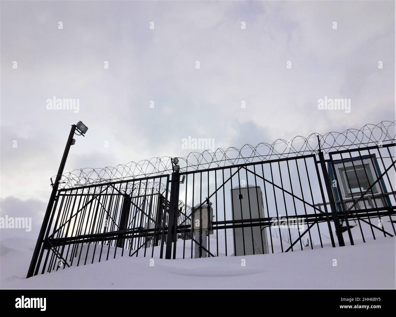 The Fence with wire and lanterns. Territory border. Border fence. Barb ...