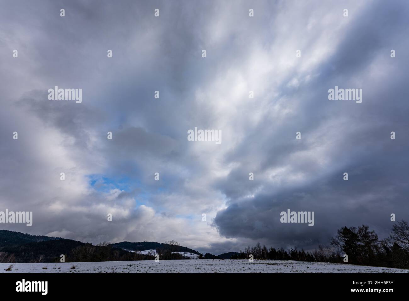Horizon with dark dramatic sky and clouds in winter. Stormy Clouds Over Farm Field Stock Photo ...